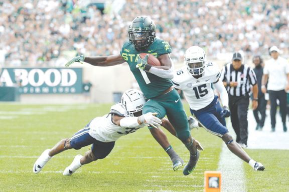 Michigan State Spartans football team runs for 6 touchdowns to blow out ...
